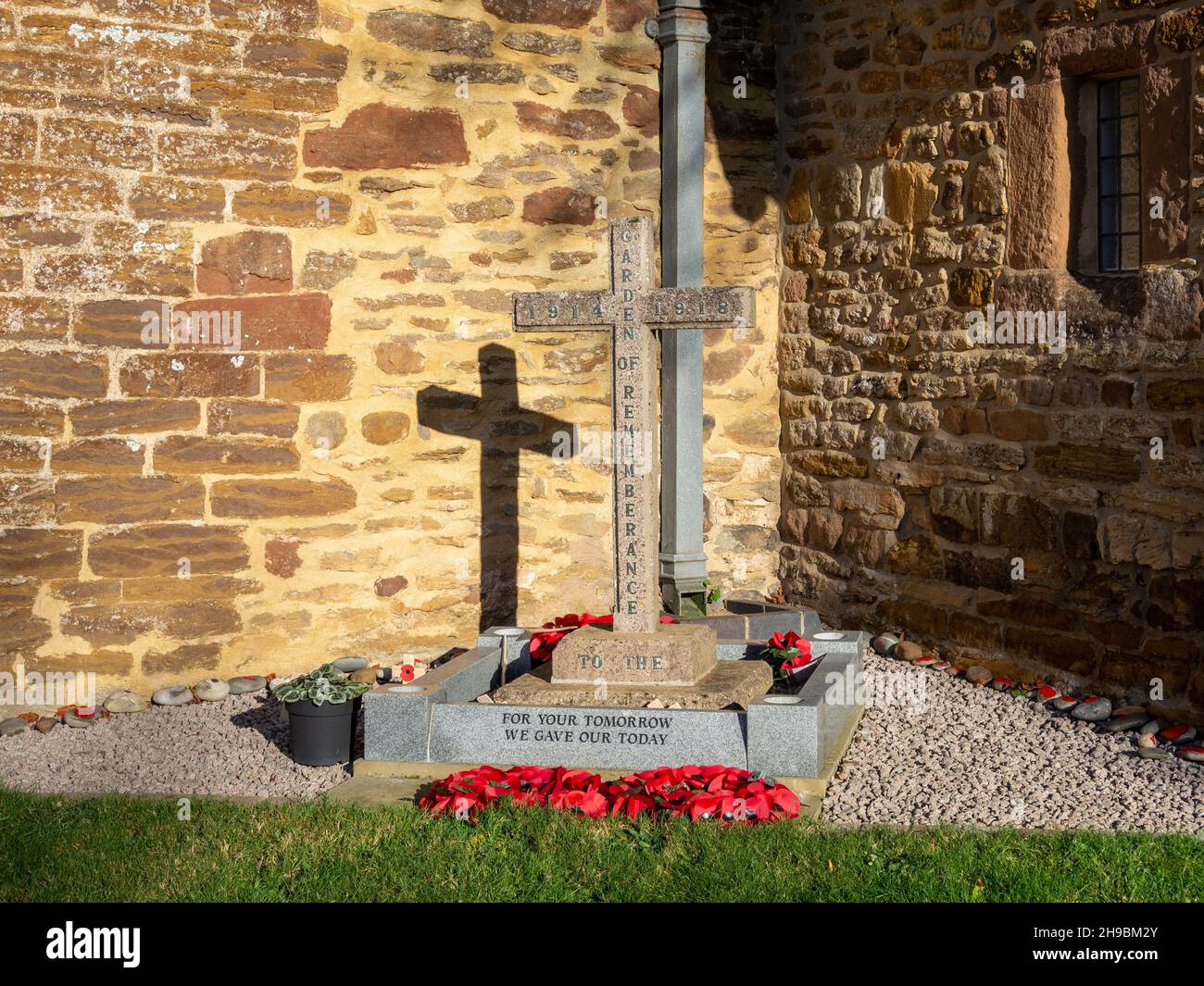 Wooden cross of sacrifice with shadow, memorial to the fallen of WW1 ...