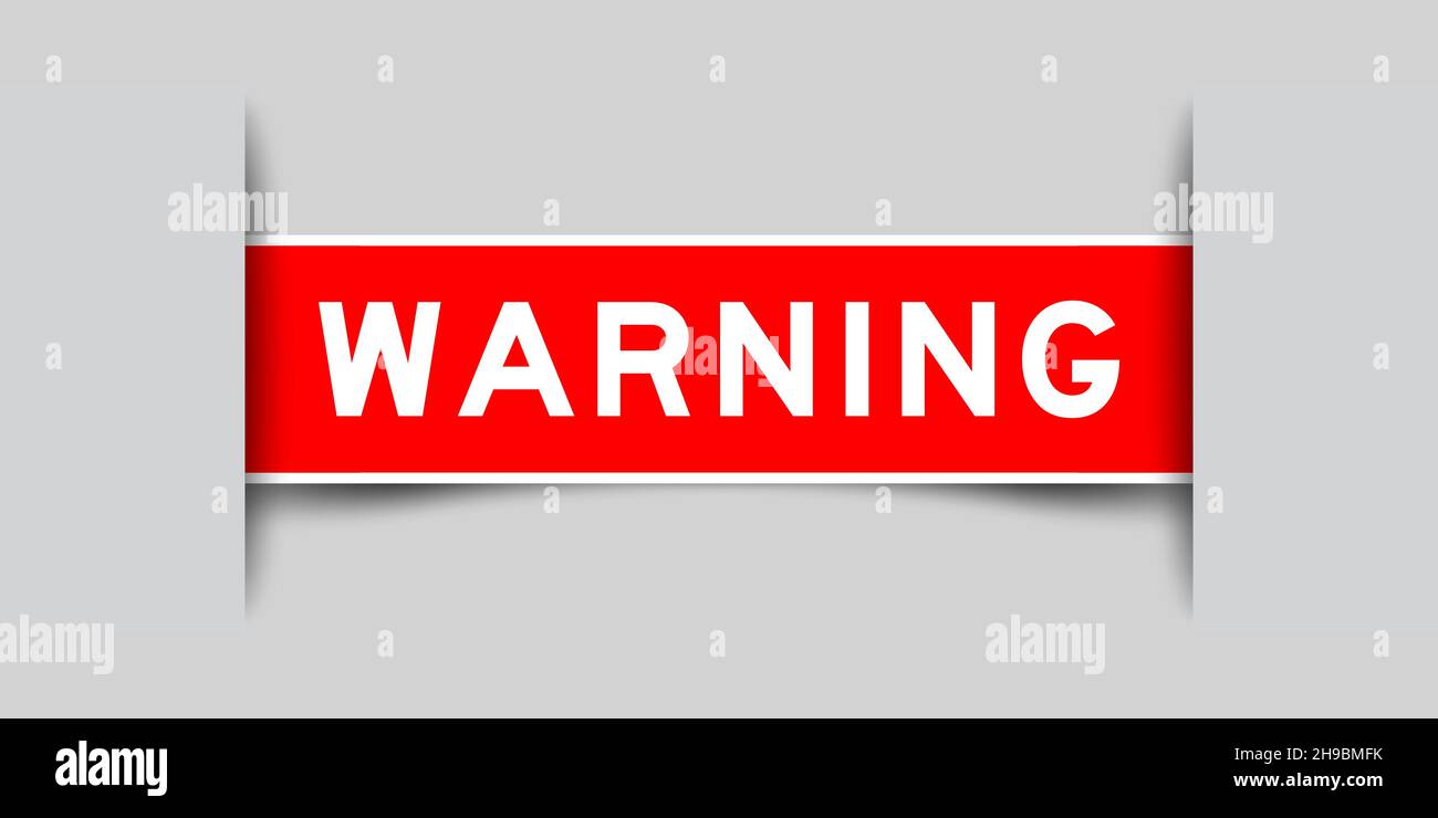 Inserted red color label sticker with word warning on gray background ...
