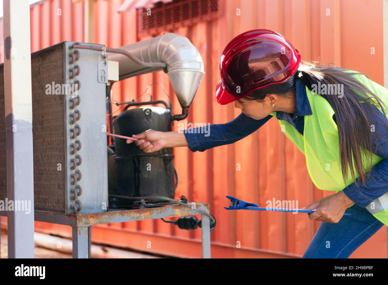 Portrait of Hispanic Female Industrial Worker Working in a Factory ...