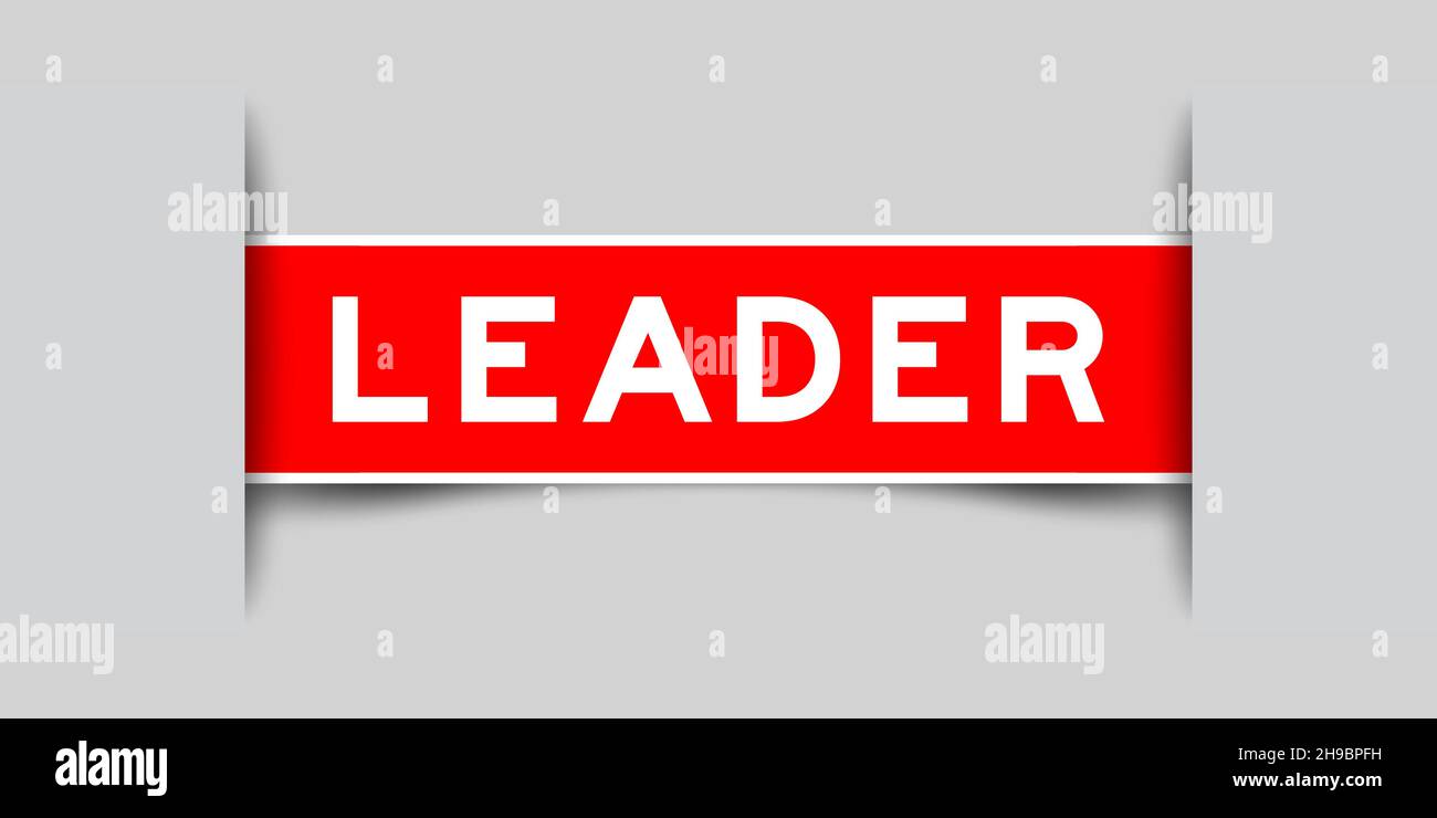 Inserted red color label sticker with word leader on gray background ...