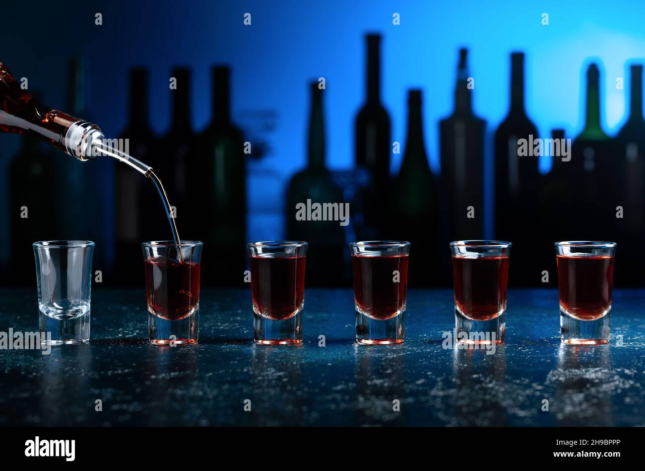 Shots of strong alcohol on a table in the bar Stock Photo - Alamy