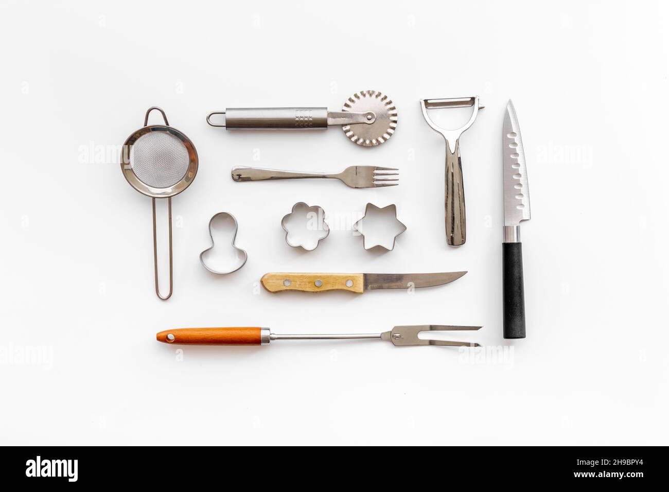 Cooking background with metal kitchen utensils and cookware Stock Photo ...