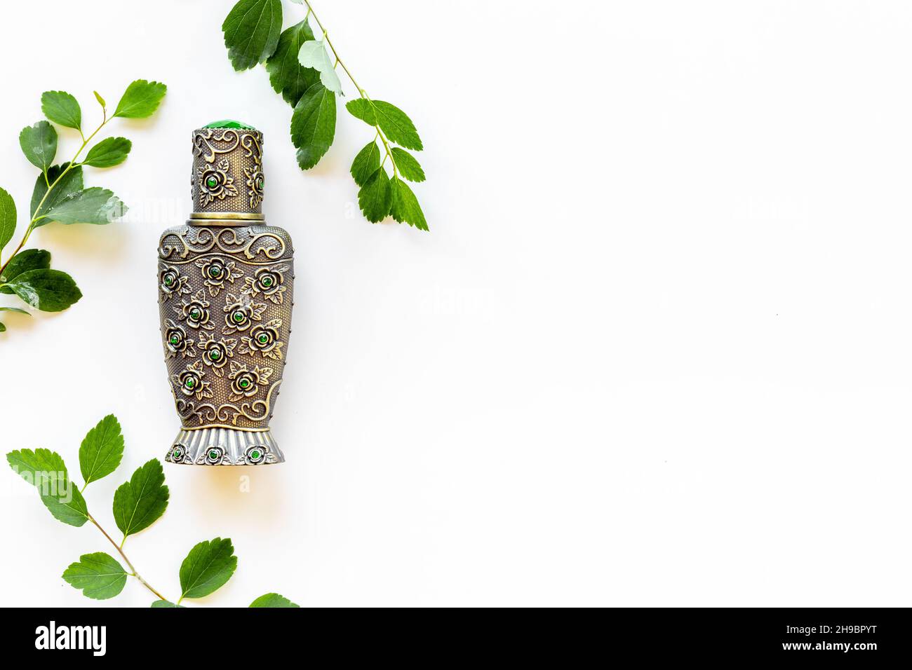 Arabian oud perfume or oil with agar wood tree Stock Photo - Alamy