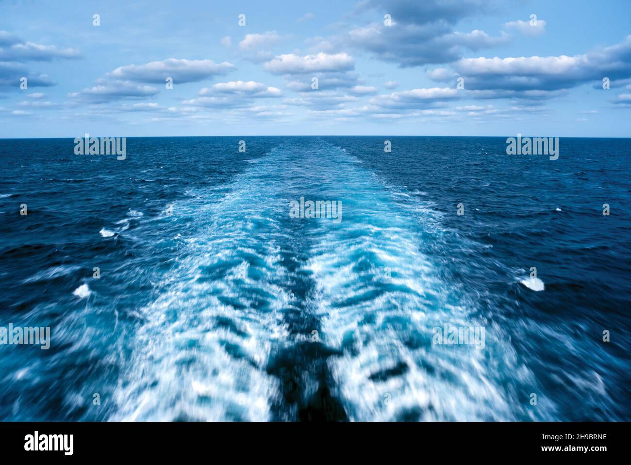 Straight ship trace in a high seas Stock Photo - Alamy