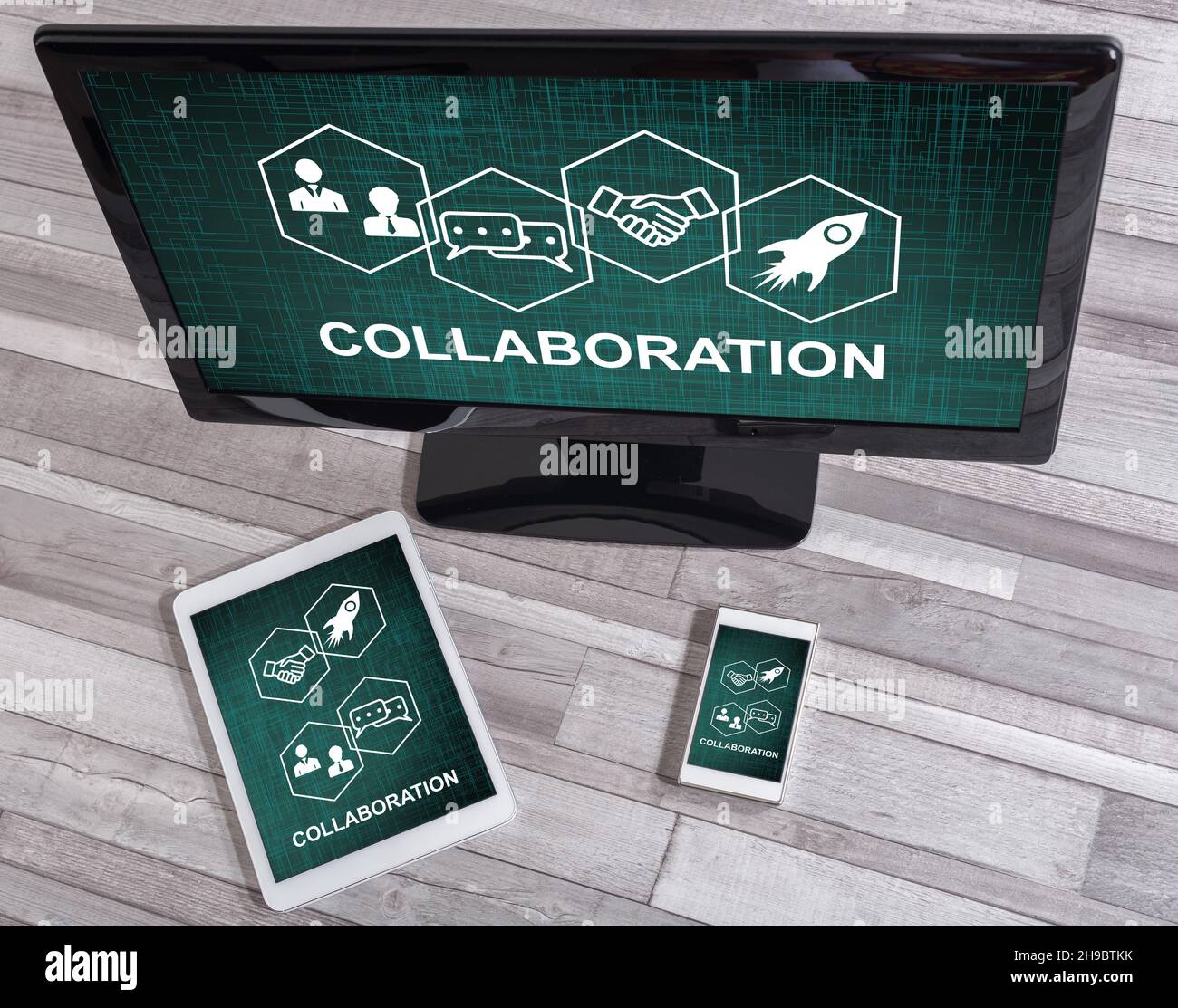 Collaboration concept shown on different information technology devices ...