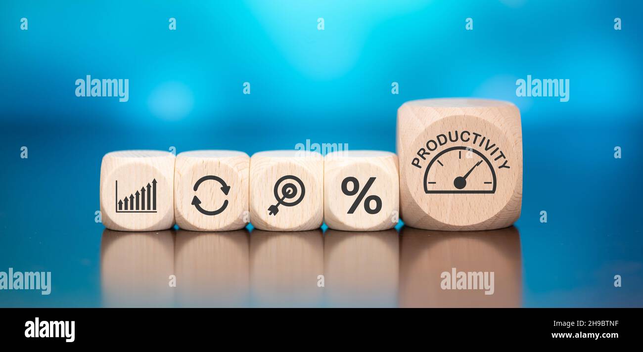 Wooden blocks with symbol of productivity concept on blue background ...