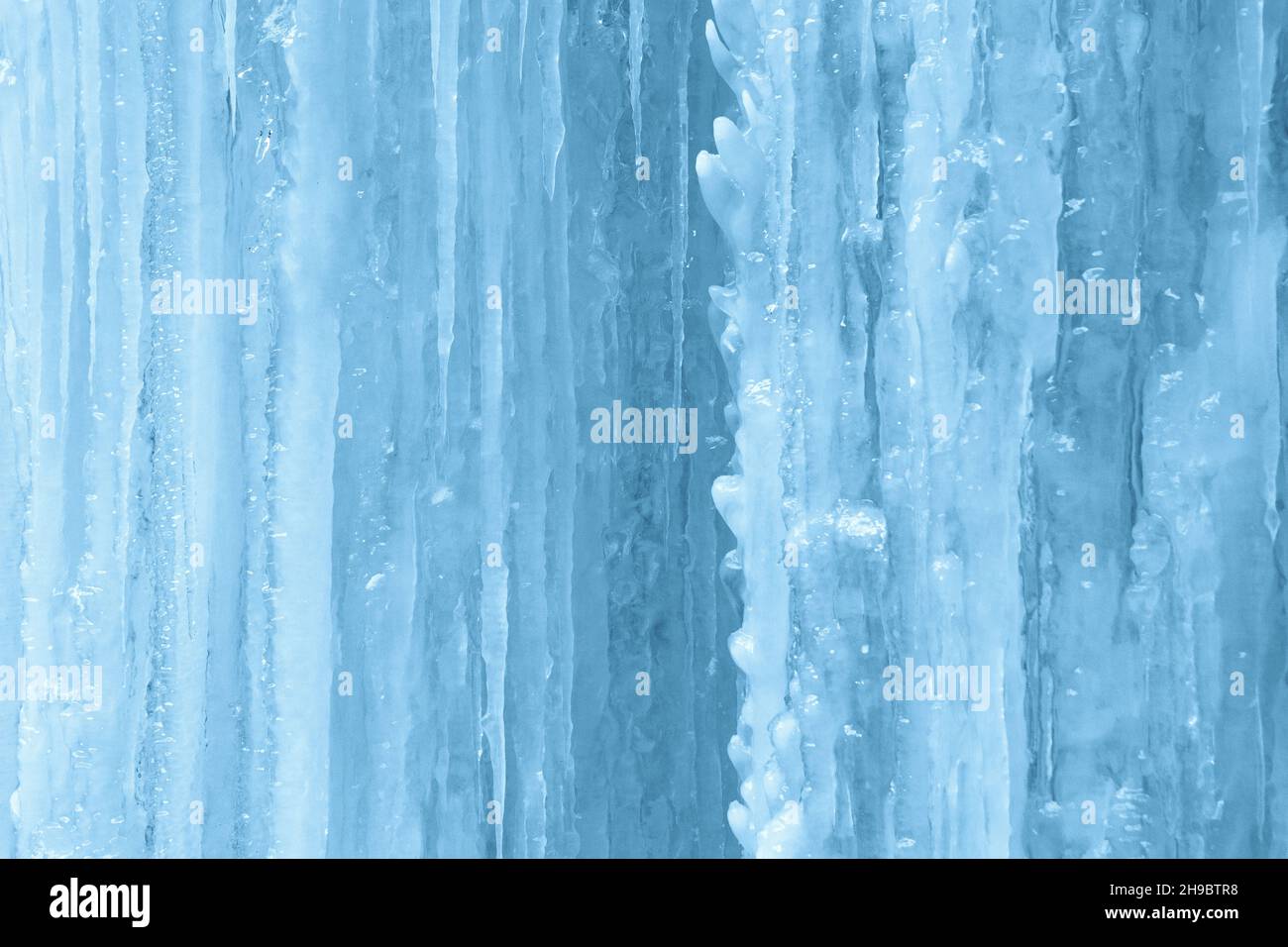 Background of icicles on frozen waterfall wall Stock Photo - Alamy