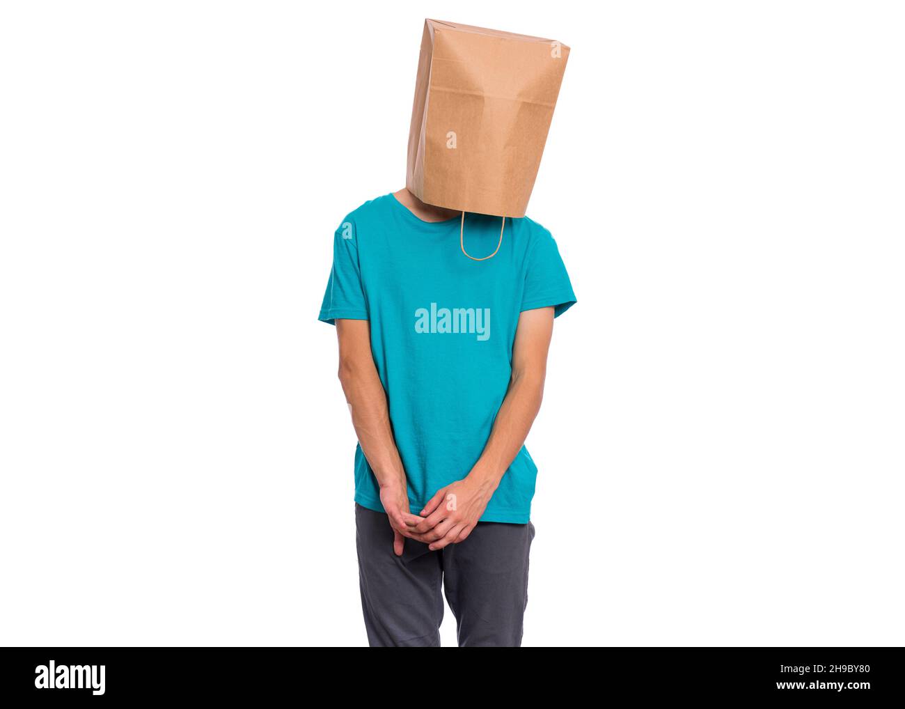 Modest teen boy with paper bag on his head holds hands. Shy Teenager ...