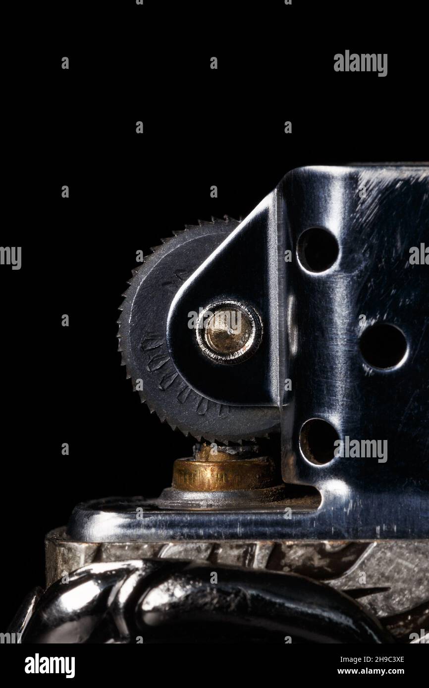 Gasoline lighter flint wheel close up on black background Stock Photo ...