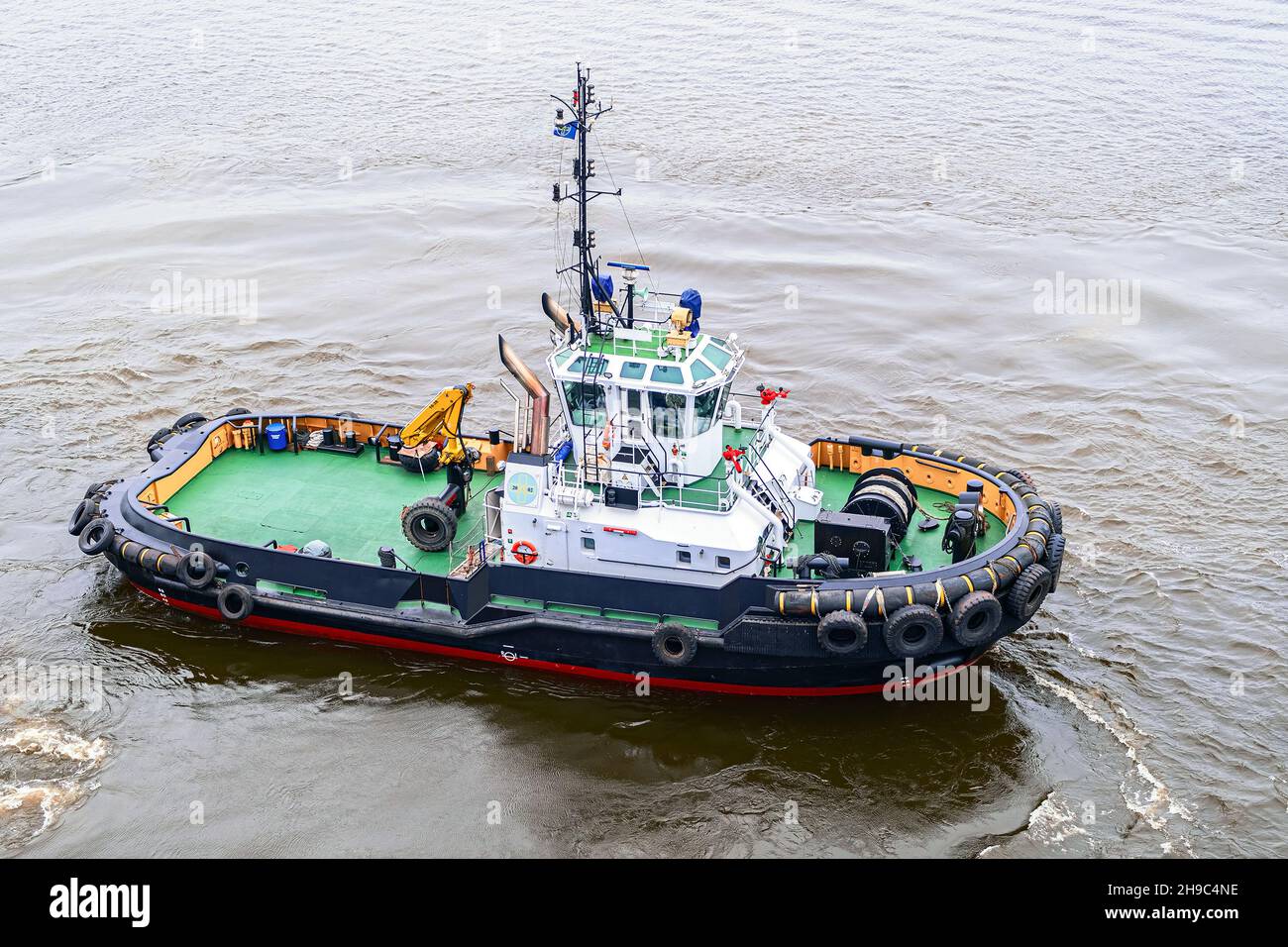 A small tugboat, photographed from the height of a quadcopter. Aerial ...