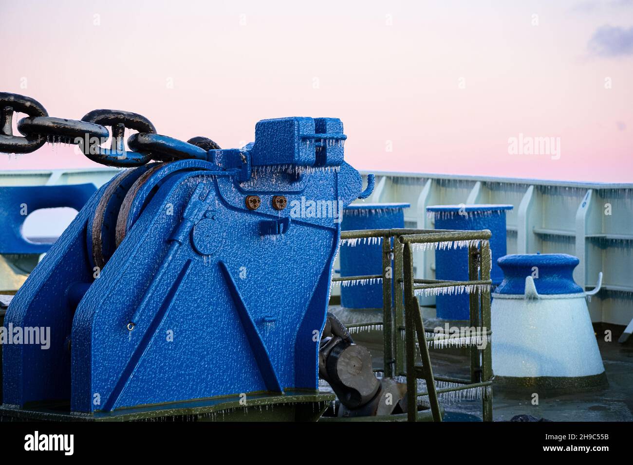 Arctic climate. The ice-class ship is covered with ice. Ice crust and ...