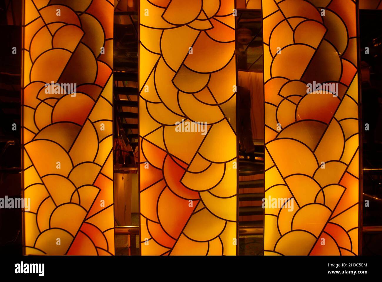 Abstract of light shining through translucent patterned glass on cruise ...