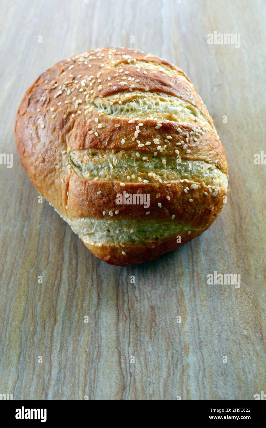 A loaf of stone baked bread on the tabletone Stock Photo - Alamy