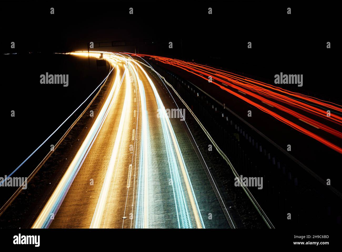 Moving cars at night on highway, long exposure. Motion blur effect of ...