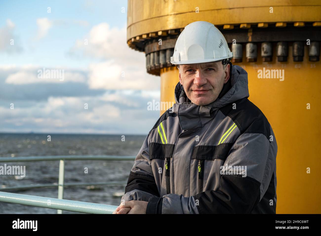 A professional in overalls. Shift worker of the Arctic oil platform. On ...