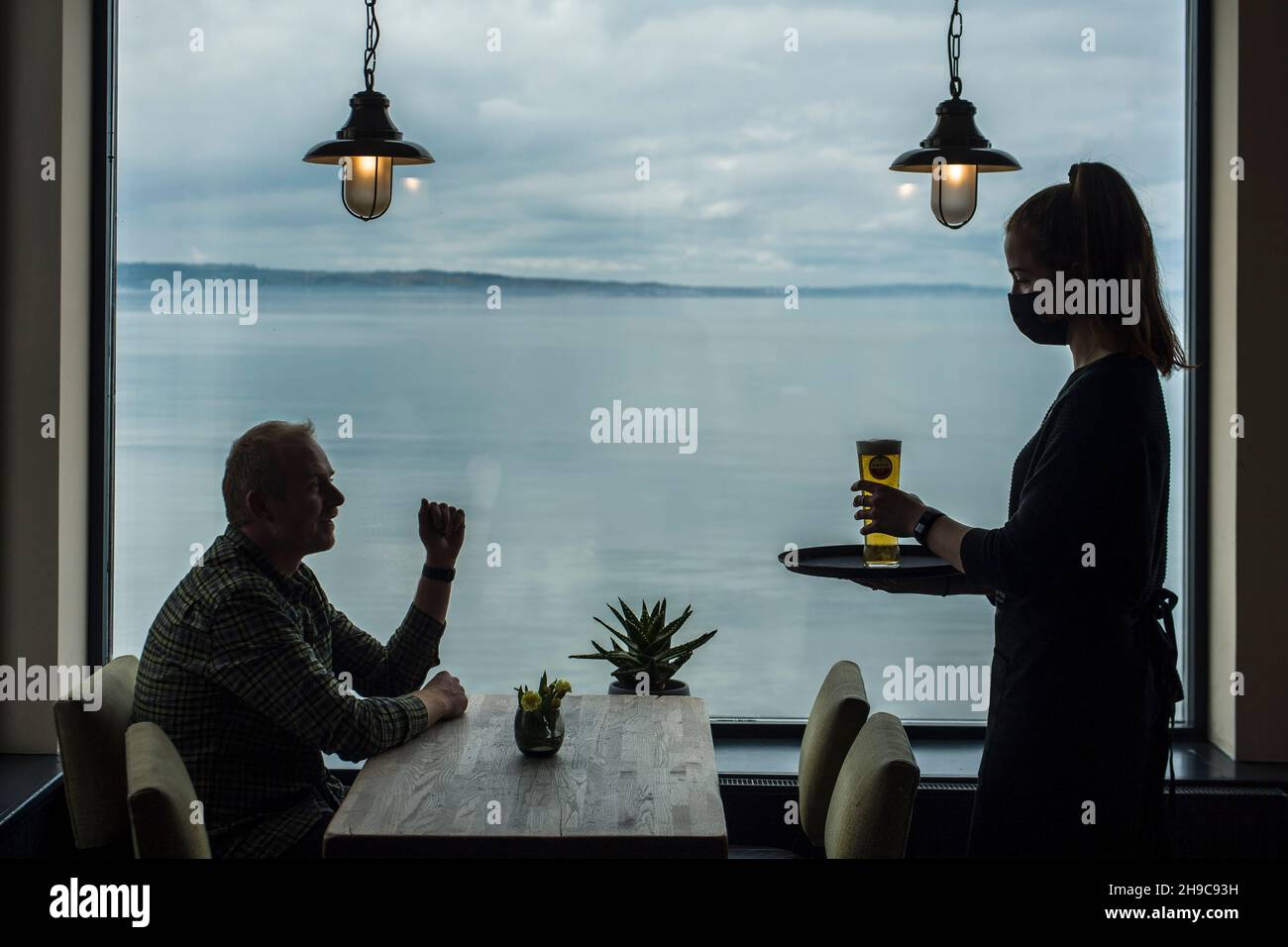 Bar staff serve alcoholic drinks for the first time inside at the Old ...