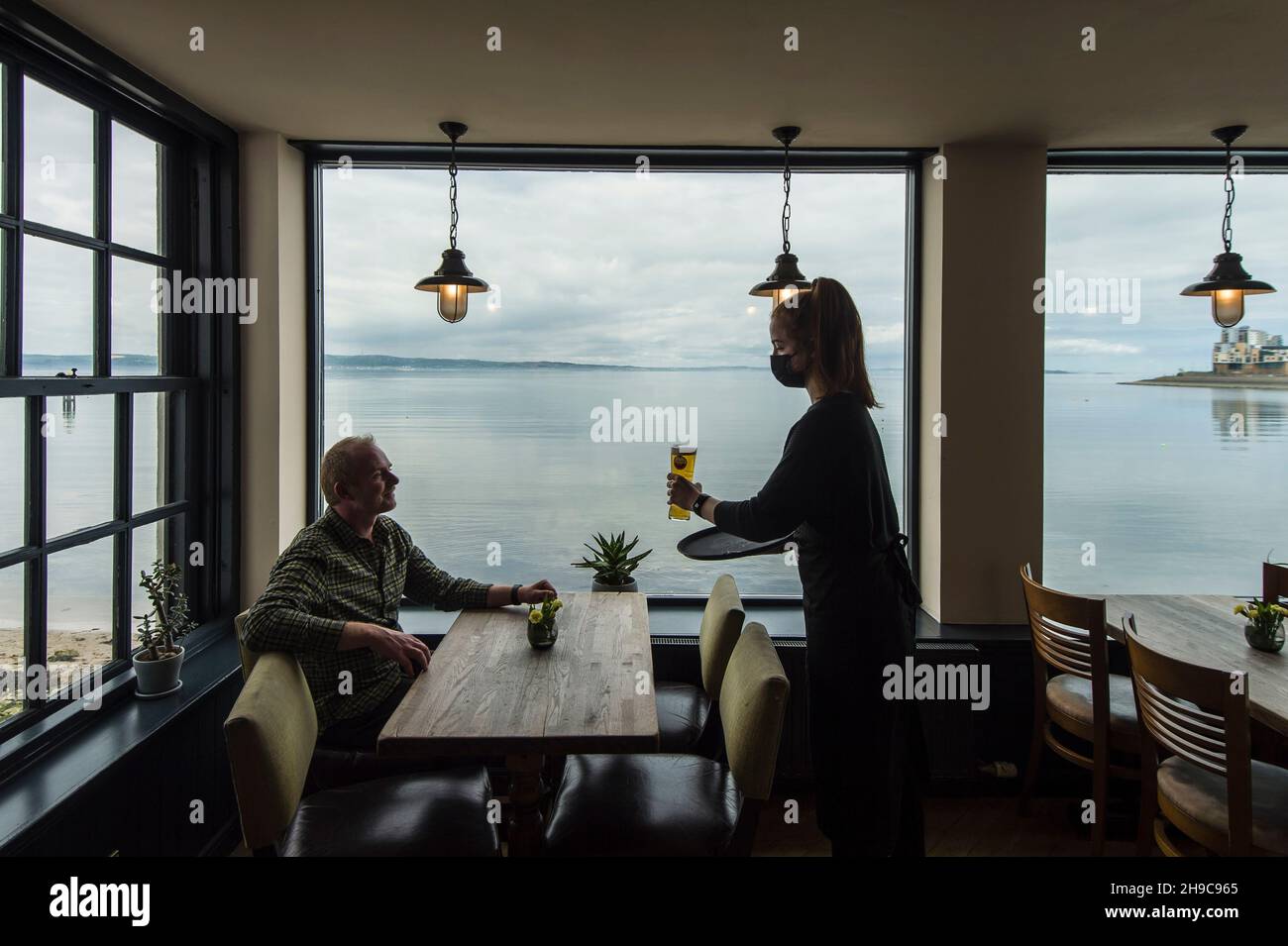 Bar staff serve alcoholic drinks for the first time inside at the Old ...