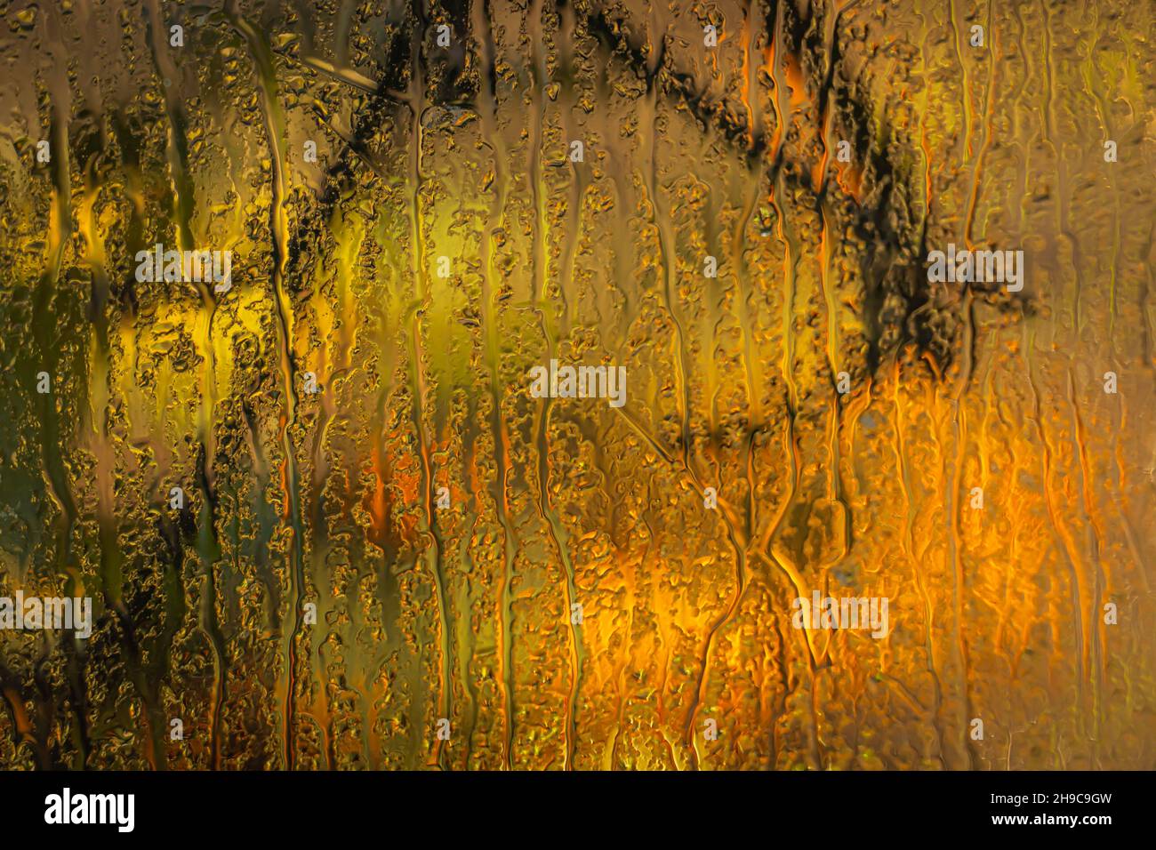 Glass foggy window overlooking colored autumn background Stock Photo ...