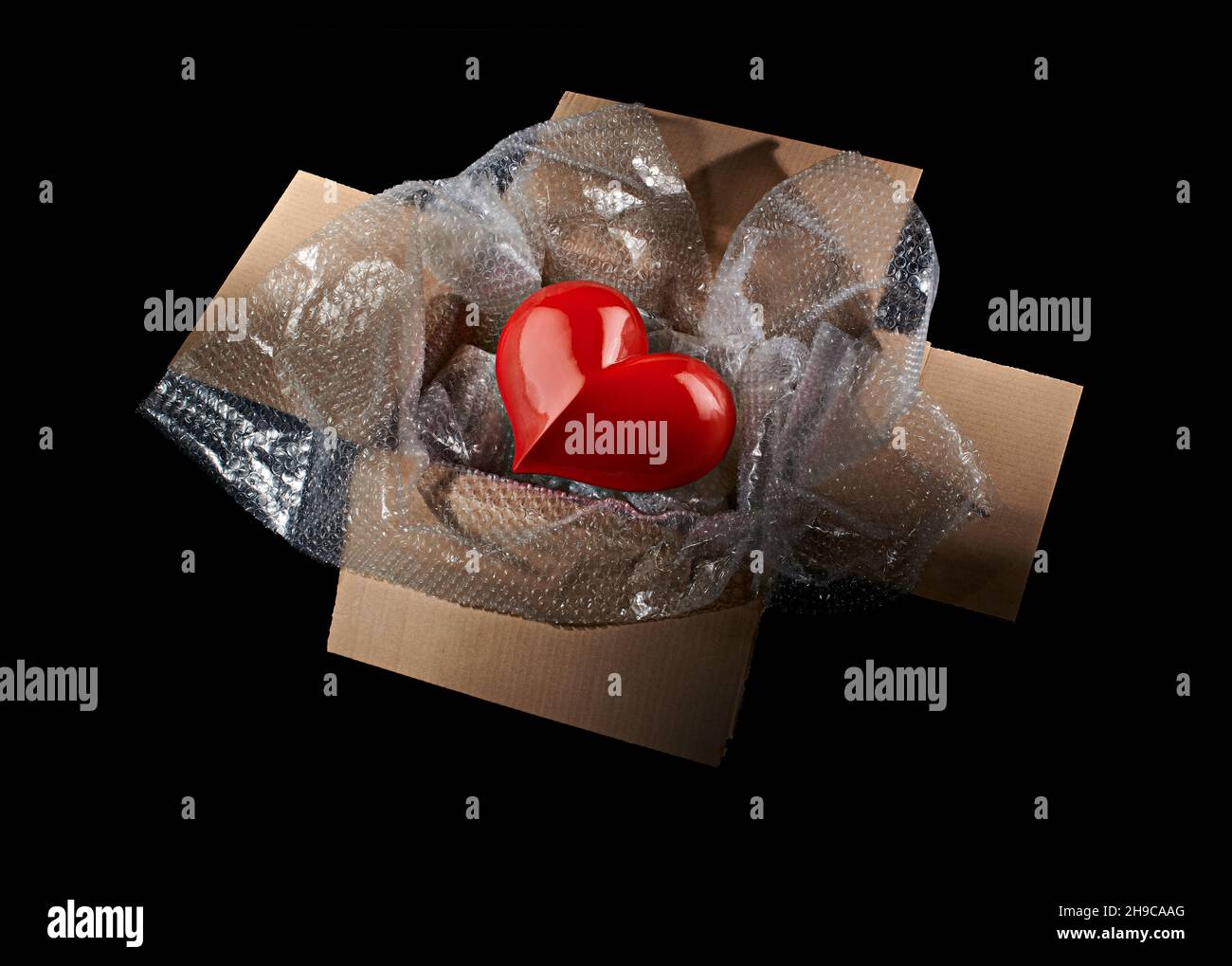 Red heart in box Stock Photo - Alamy