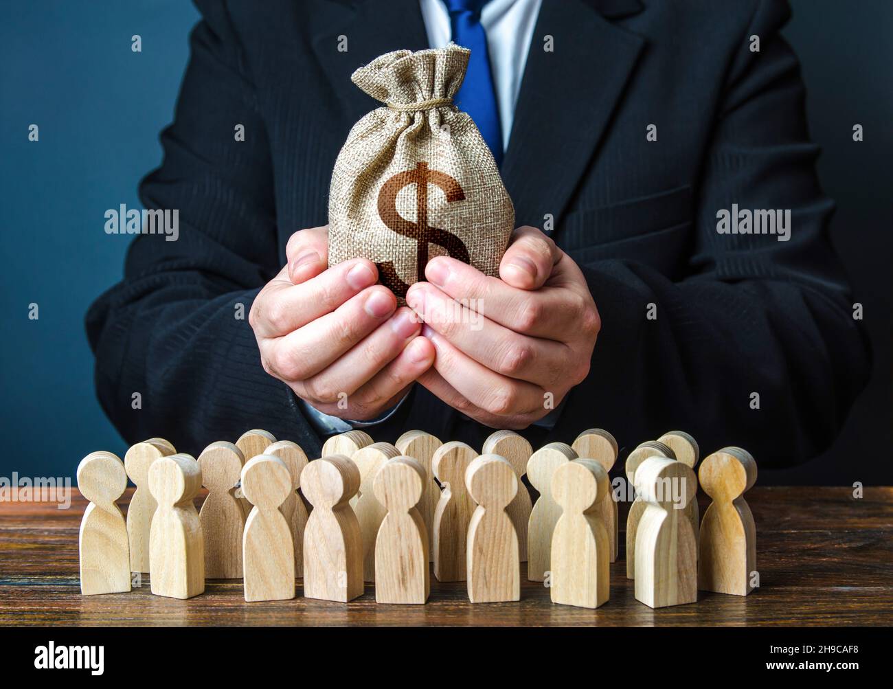 Businessman holds out a dollar money bag to the crowd. Official ...
