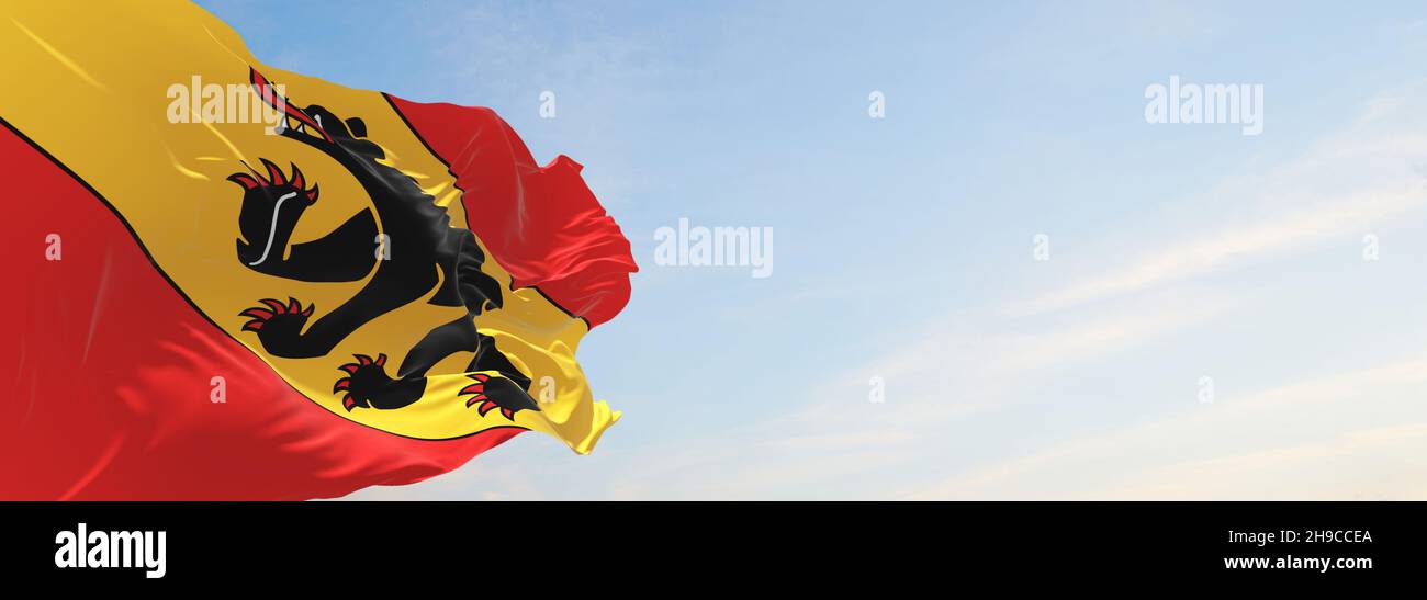 flag of Canton of Bern , Switzerland at cloudy sky background on sunset ...