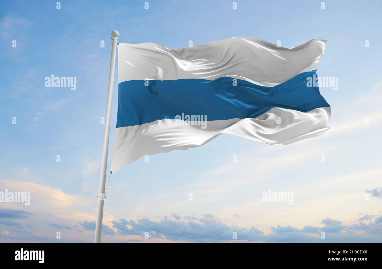 flag of Canton of Zug , Switzerland at cloudy sky background on sunset ...