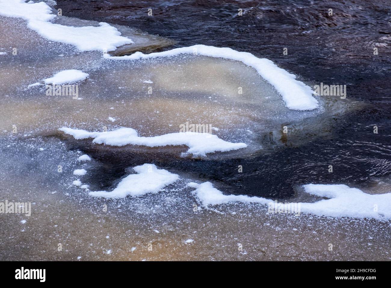 Ice floating in a river Stock Photo - Alamy