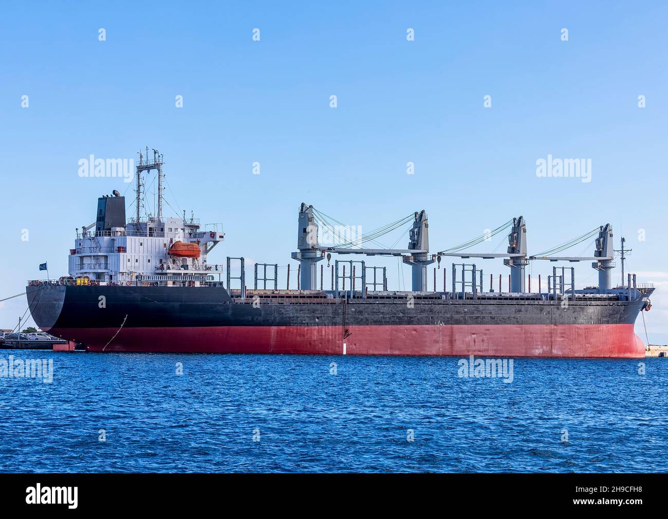 Cargo Ship In The distance. Isolated Stock Photo - Alamy