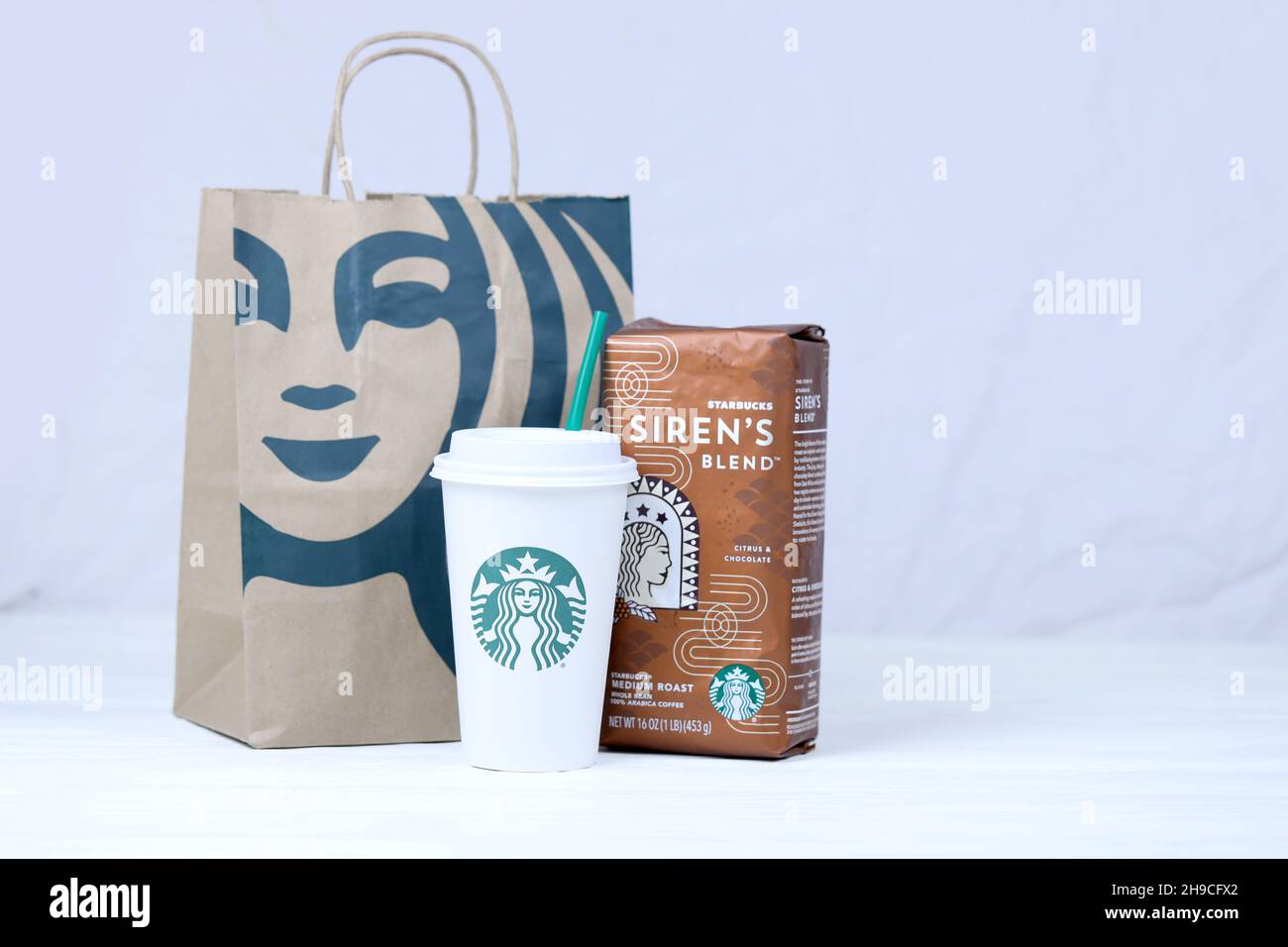 KHARKOV, UKRAINE - MARCH 15, 2021: Starbucks production on white wooden ...