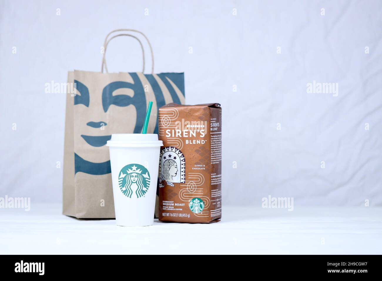 KHARKOV, UKRAINE - MARCH 15, 2021: Starbucks production on white wooden ...