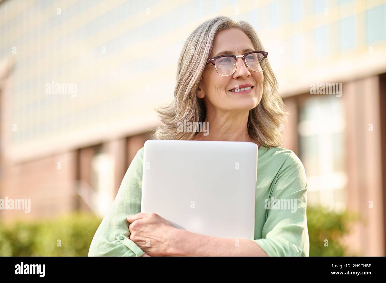 Hugging laptop hi-res stock photography and images - Alamy
