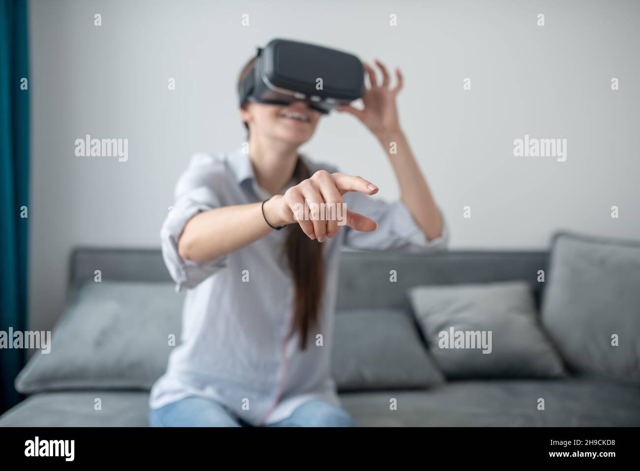 Vr gamer on sofa hi-res stock photography and images - Alamy