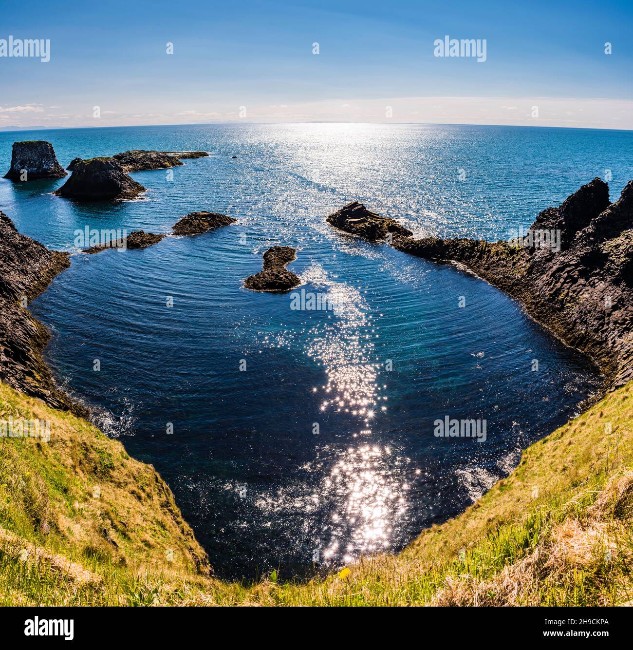 Panorama of a cove and rock stacks at the Arnarstapi Cliffs ...