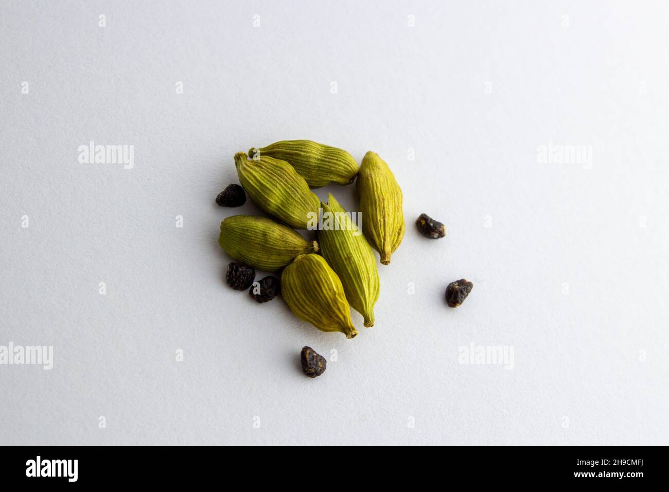 Pile of whole cardamom isolated on white background Stock Photo - Alamy
