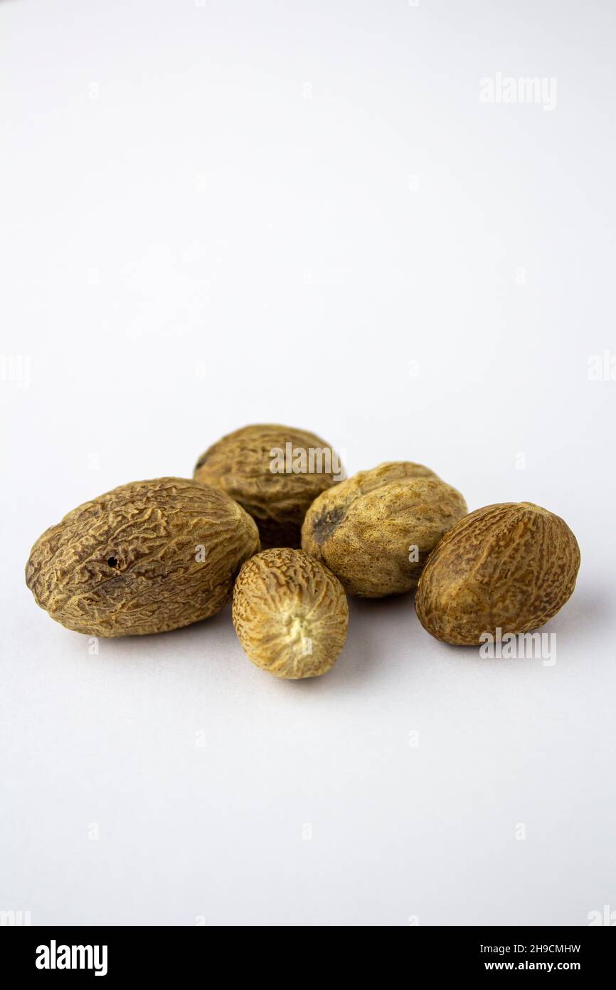 Nutmeg isolated on a white background Stock Photo - Alamy