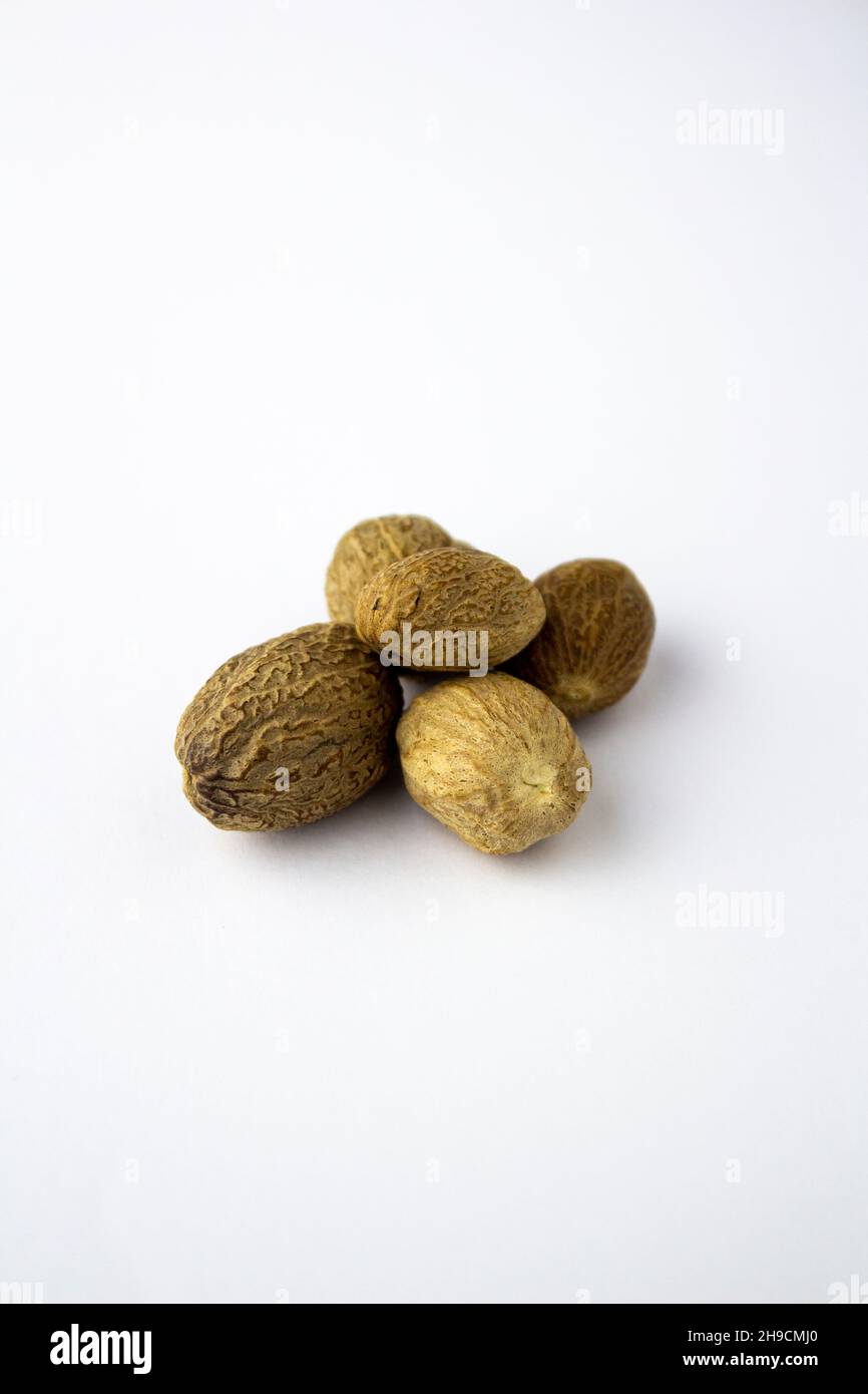 Nutmeg isolated on a white background Stock Photo - Alamy