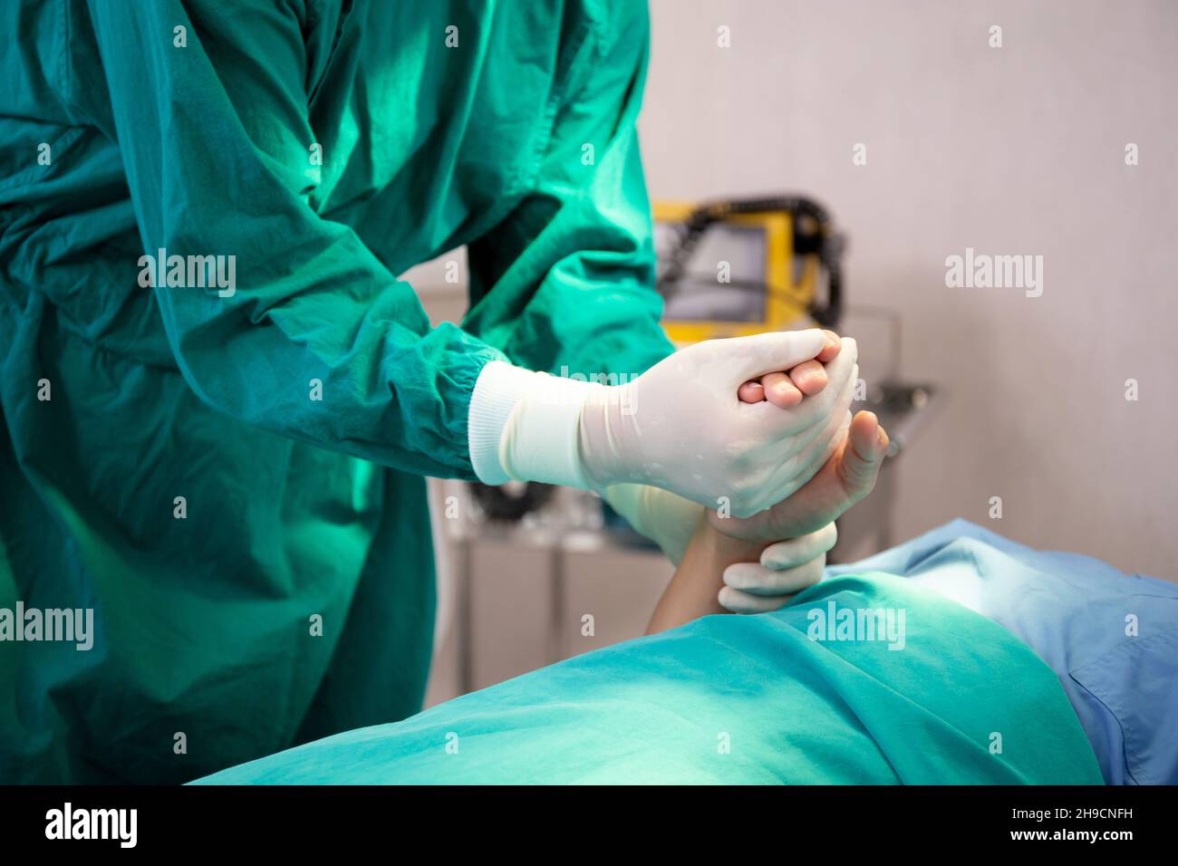 Hands of doctor holding with patient for encourage and trust at ...