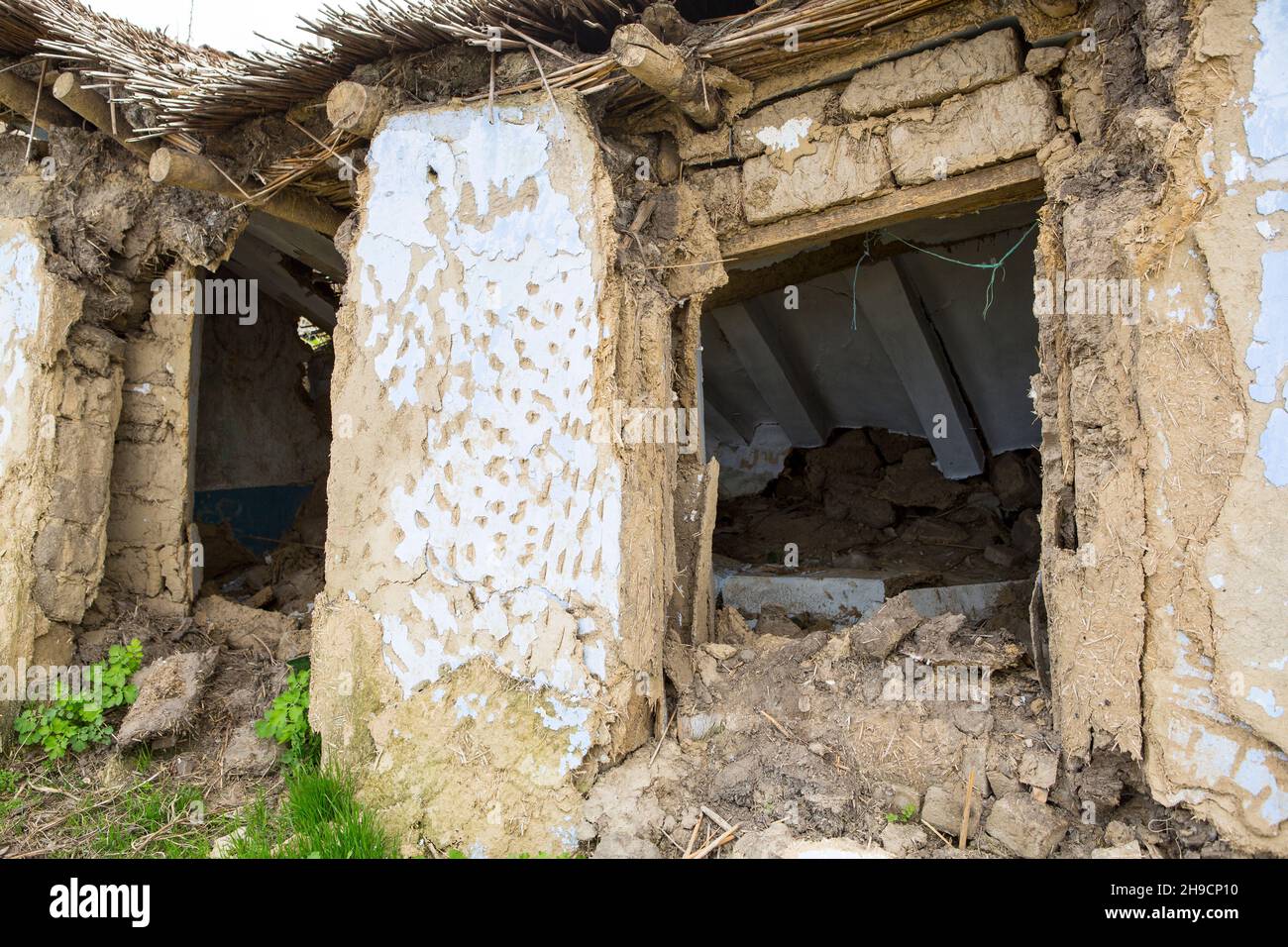 Ruined old house. Ruins of a house made of shell rock, straw and clay ...
