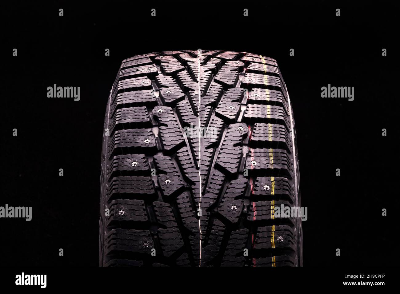 winter studded tire front view close-up on black background tread Stock ...