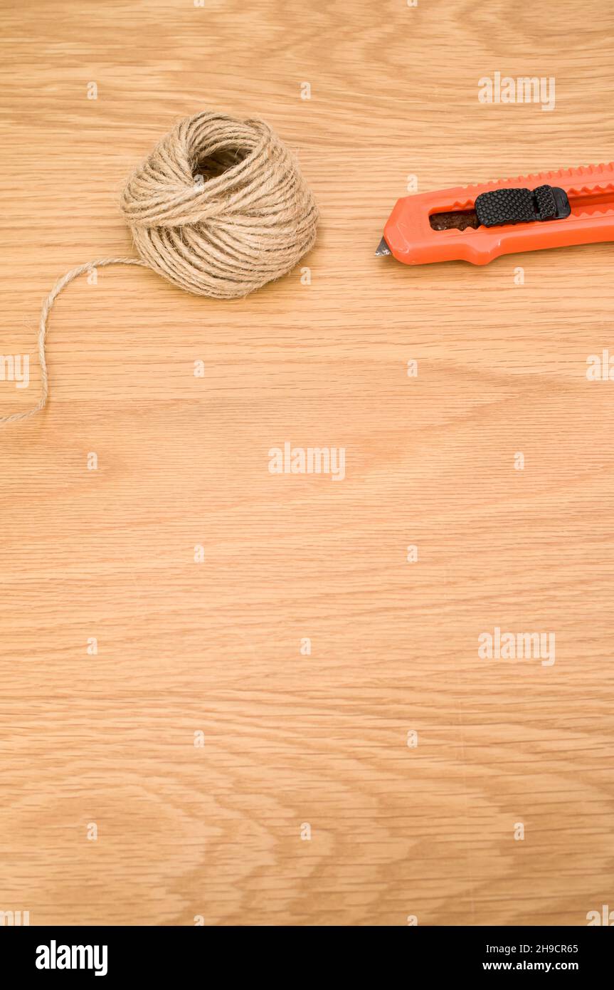 cutter and rough string on a wooden tabletop background Stock Photo - Alamy