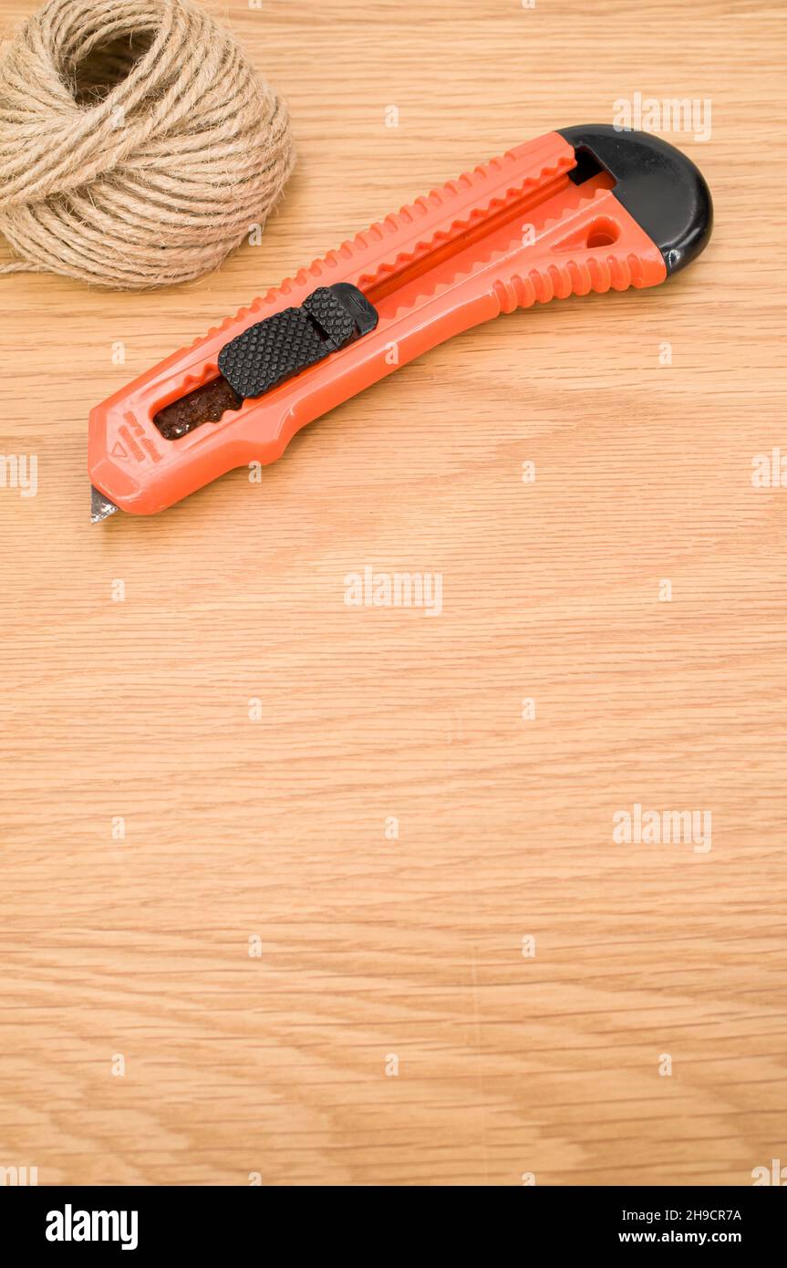 cutter and rough string on a wooden tabletop background Stock Photo - Alamy