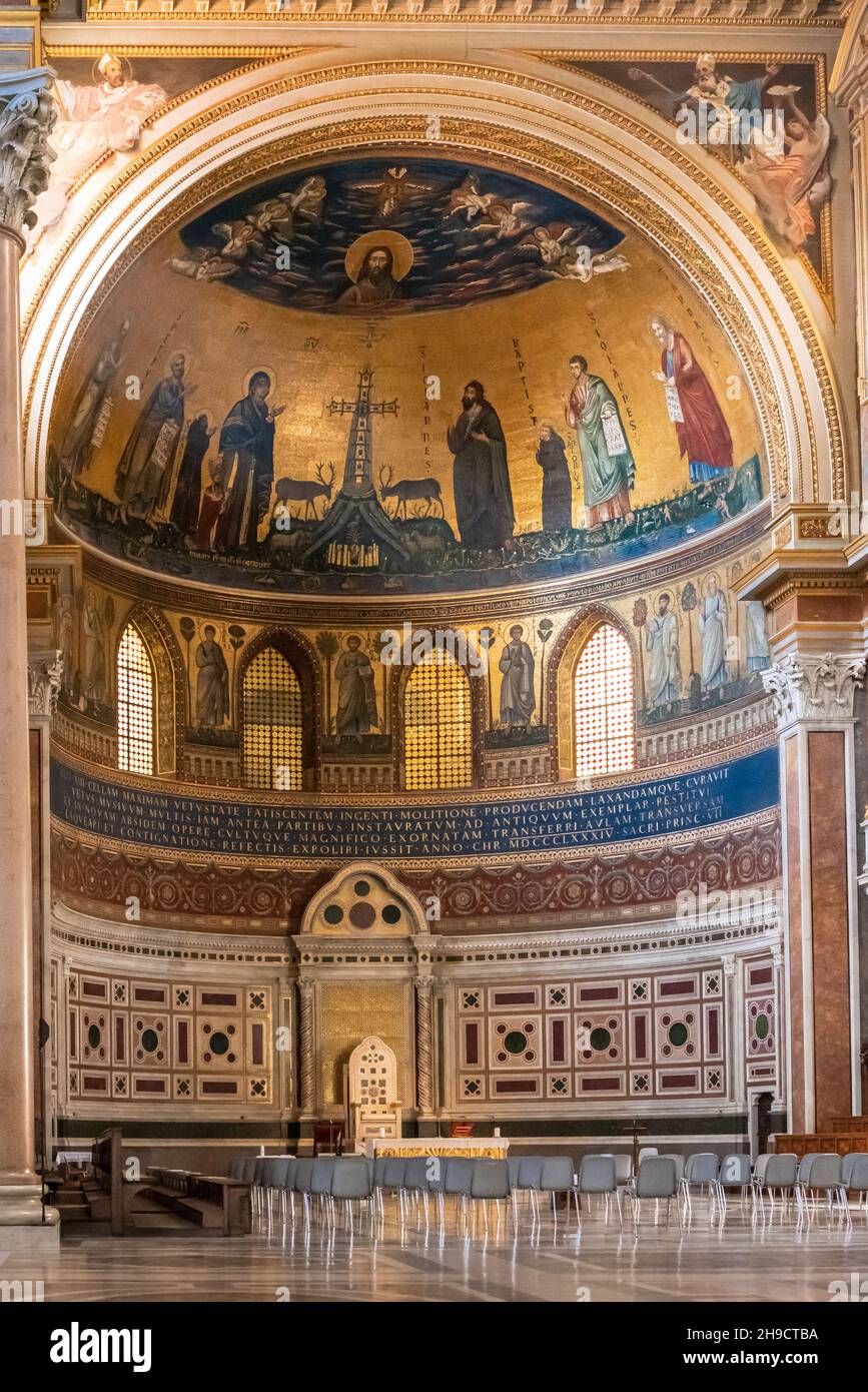 Golden religious mosaic decorating wall inside catholic cathedral in ...