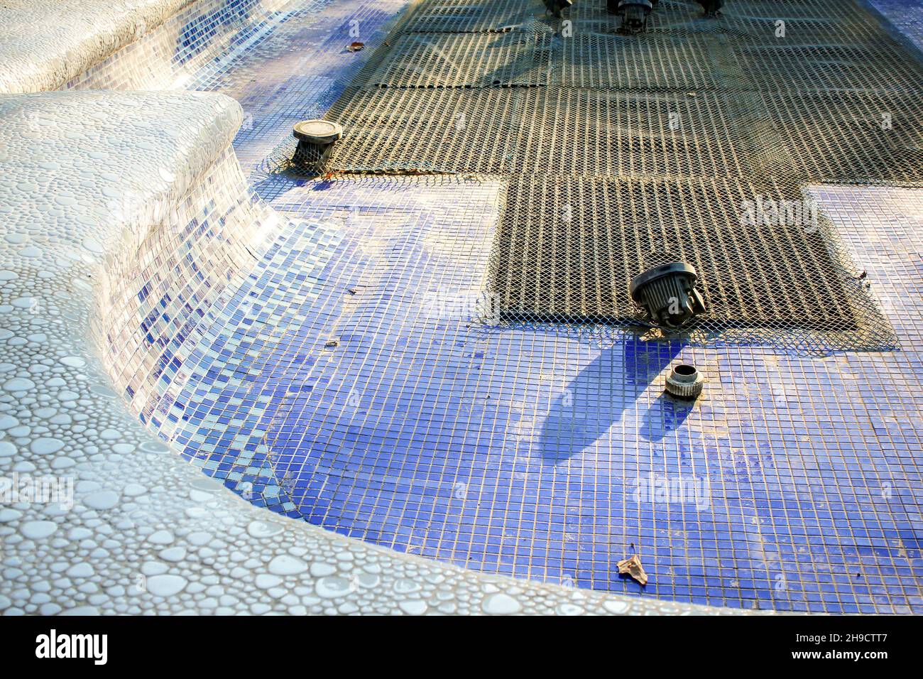Empty fountain with blue and purple mosaic layer Stock Photo - Alamy