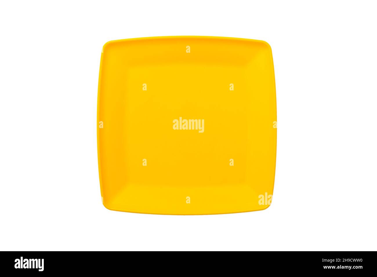yellow plastic square plate isolated over white background. Top view ...