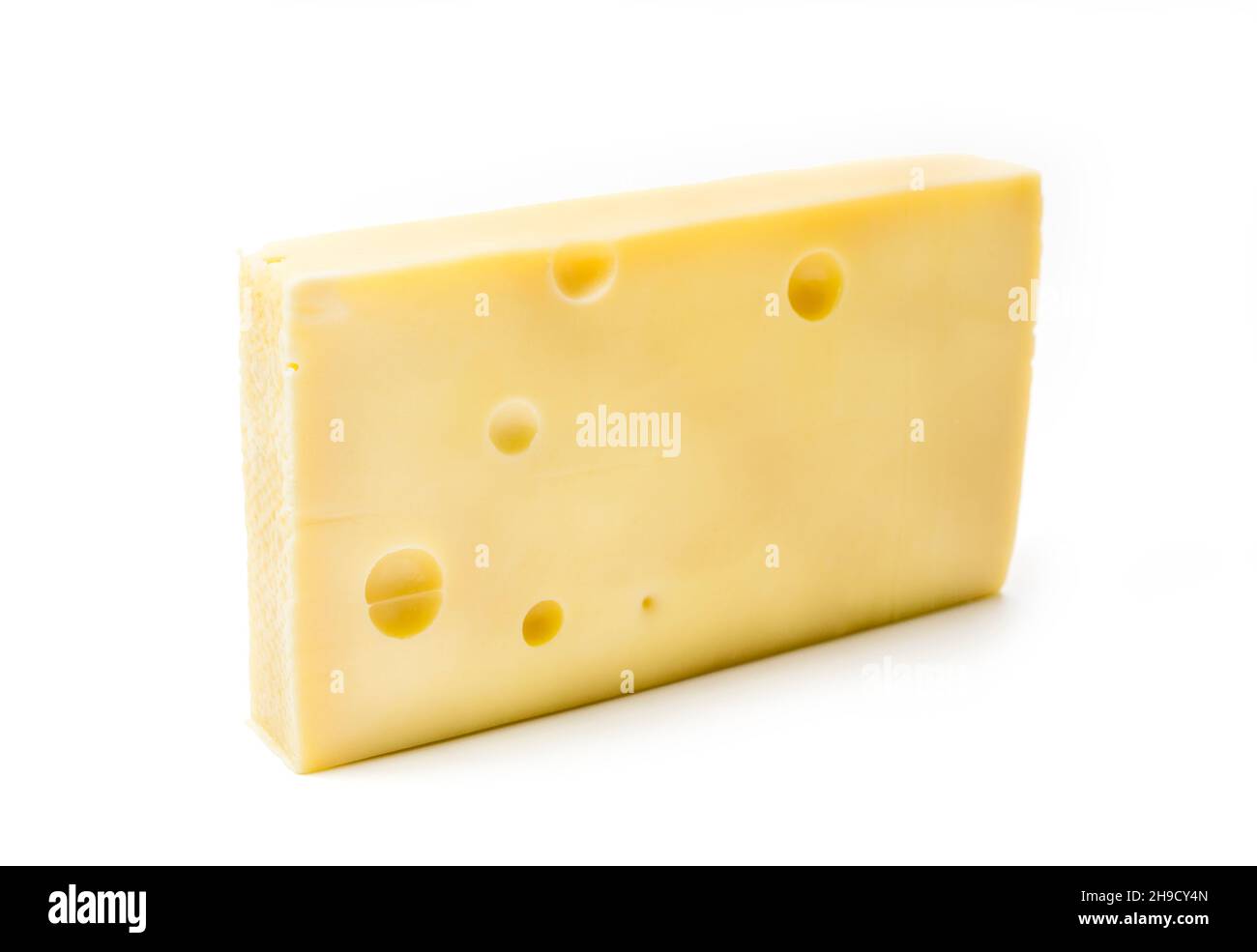 A piece of organic Emmental cheese isolated over white background ...