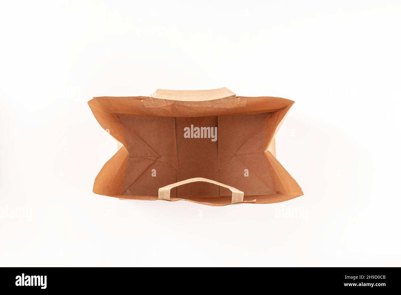 Open paper bag, brown shopping bag on white background. Top view Stock ...