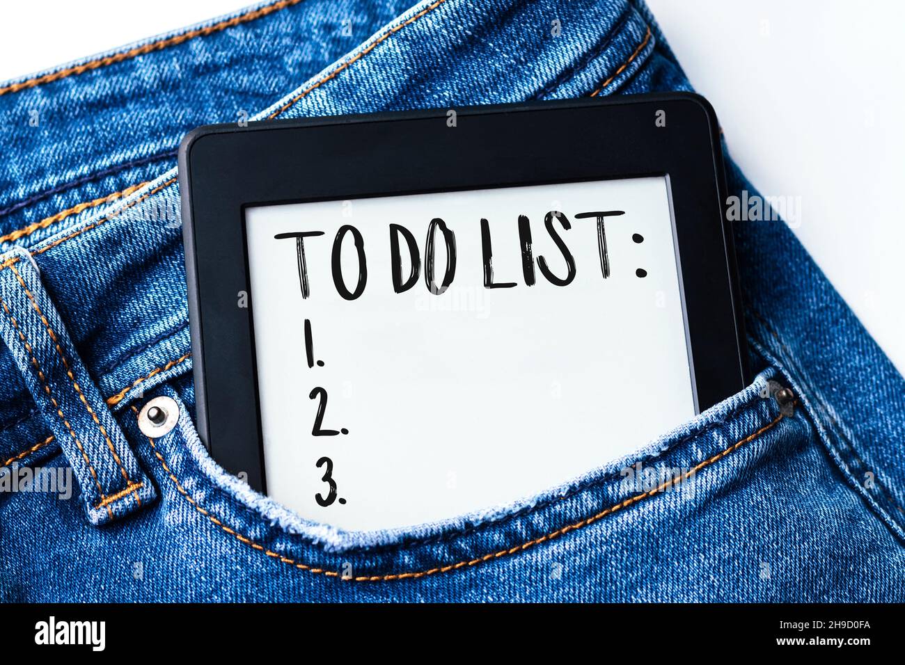 Modern black tablet with to do list in the front pocket of bright blue ...