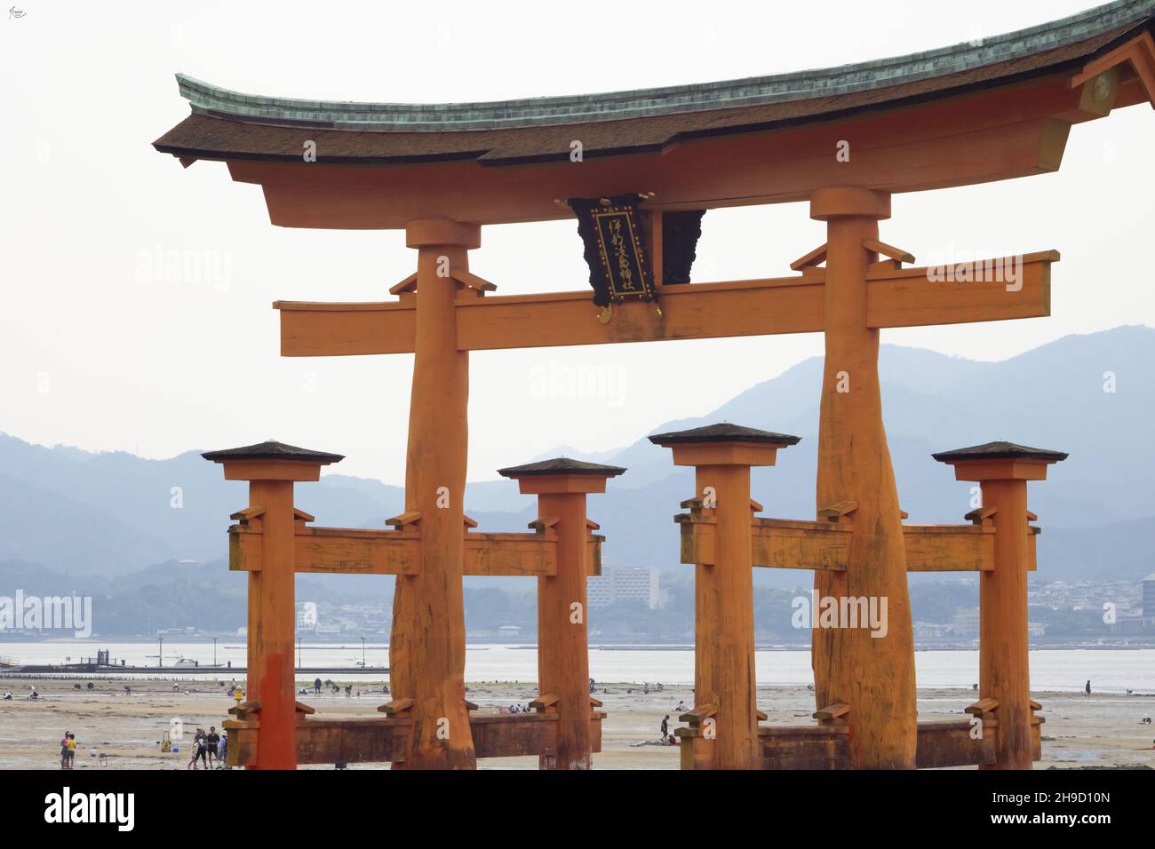 Itsukushima Shrine gate on the background of the sea and mountains in ...
