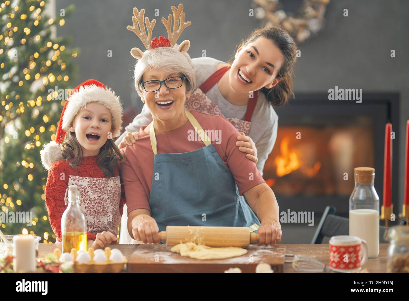 Merry Christmas and Happy Holidays. Family preparation holiday food ...