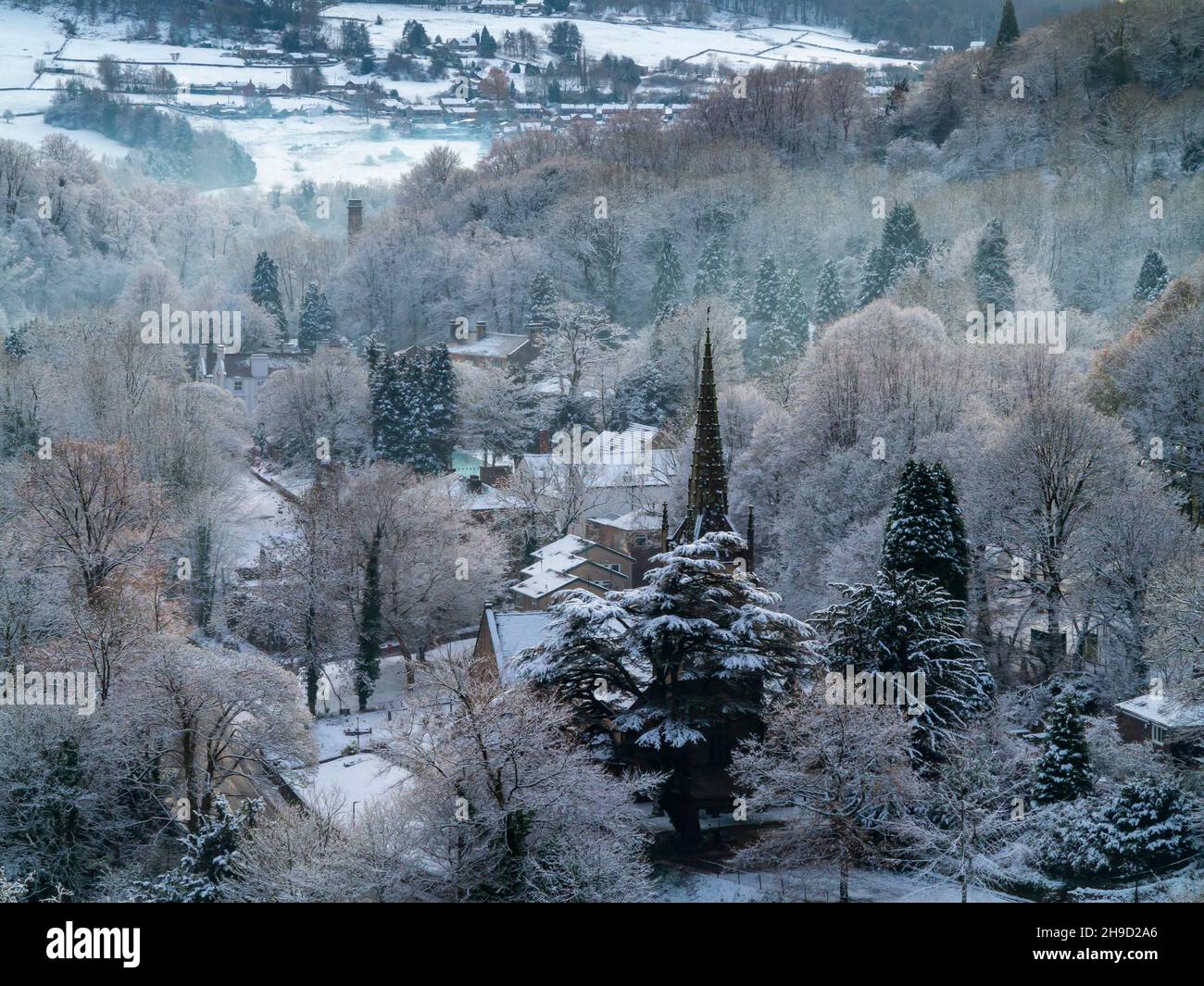 Snow covered landscape with trees at Matlock Bath in the Derbyshire ...